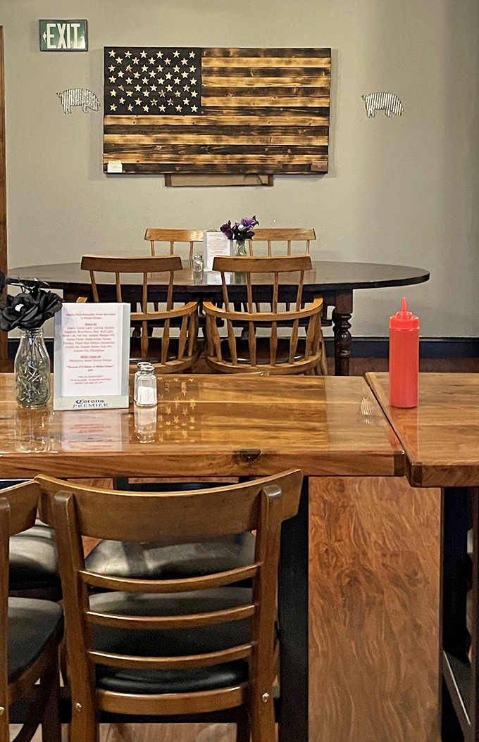 Simple wooden tables, American flag art, and squeeze bottles of sauce at the ready &ndash; BBQ paradise doesn't need fancy chandeliers to light up your taste buds.