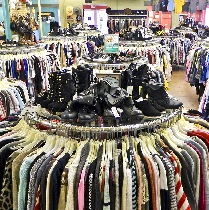 Circular racks create a treasure map of possibilities, with boots standing sentinel in the center like fashion lighthouses.