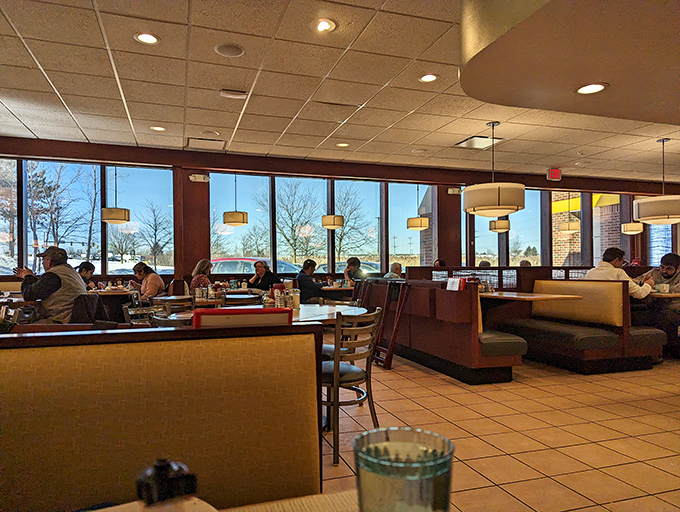 Morning sunshine streams through windows illuminating a bustling breakfast sanctuary where coffee mugs clink and weekend plans are hatched over hash browns.