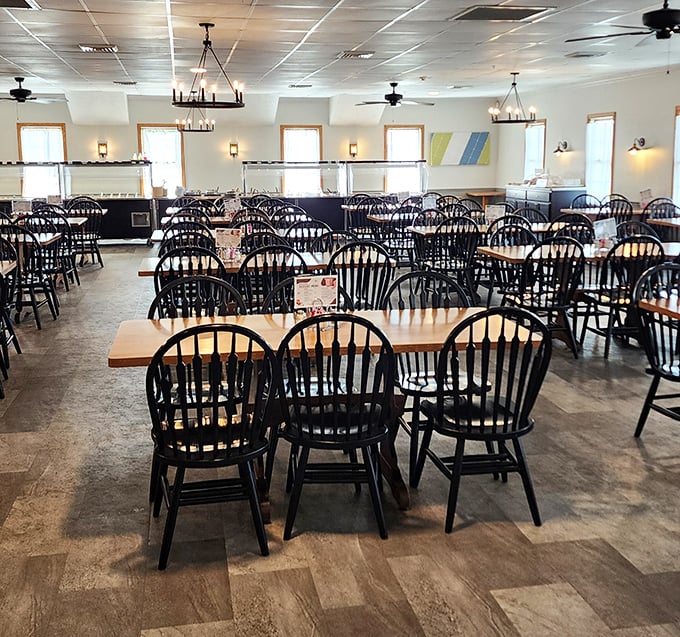 A welcoming dining room where Windsor chairs aren't just furniture, but invitations to sit down and stay awhile. No fancy tablecloths needed when the food is this good.