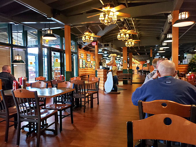 Inside, rustic chandeliers cast a golden glow over wooden tables, creating that perfect "mountain lodge meets meat sanctuary" atmosphere that makes you instantly feel at home.