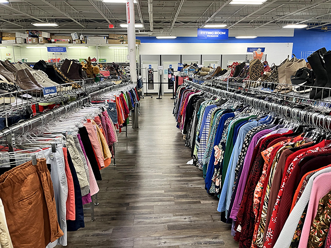 Clothing racks stretch to the horizon like a textile Grand Canyon. Each aisle promises fashion redemption at a fraction of retail prices.
