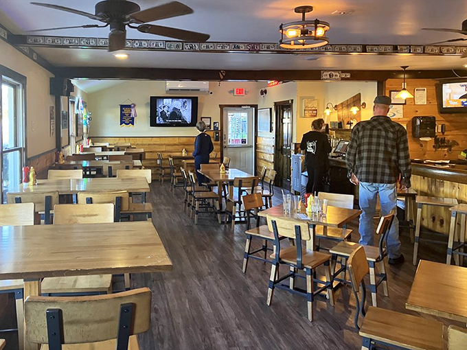 Simple wooden tables and warm lighting create the perfect stage for the real star of the show—what's about to arrive on your plate.