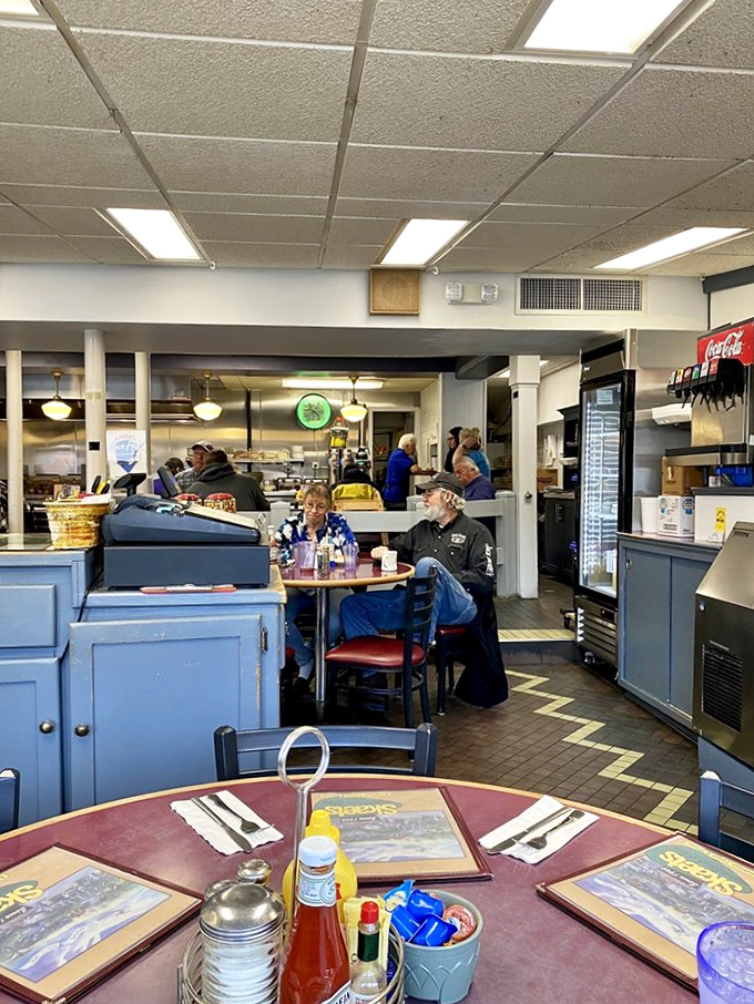 Blue booths and simple tables create the perfect backdrop for culinary magic. This isn't Instagram-bait d&eacute;cor&mdash;it's the real deal where conversations and memories are made. 