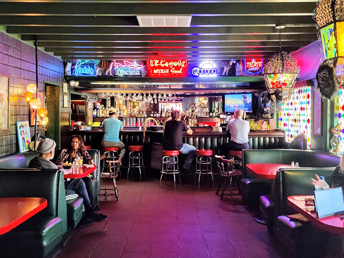 Step inside and you're transported to a world where neon beer signs, cozy booths, and the promise of strong margaritas make everyday troubles disappear.