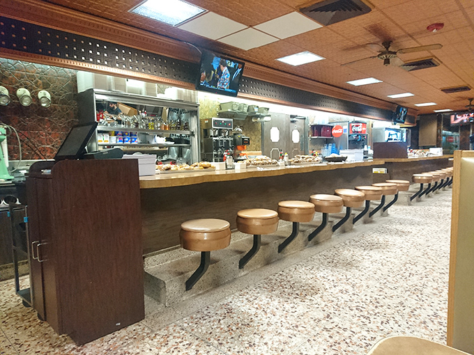 Counter seats where strangers become friends and the coffee keeps flowing. Watching short-order cooks here beats any cooking show on TV.