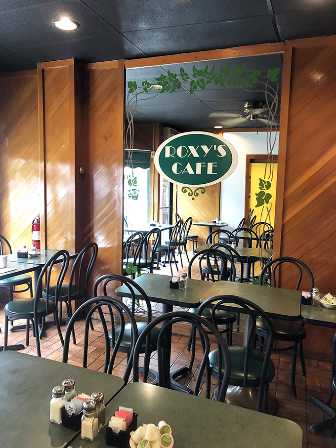 The warm wooden paneling and classic caf&eacute; chairs create that rare atmosphere where both first-timers and regulars feel instantly at home.