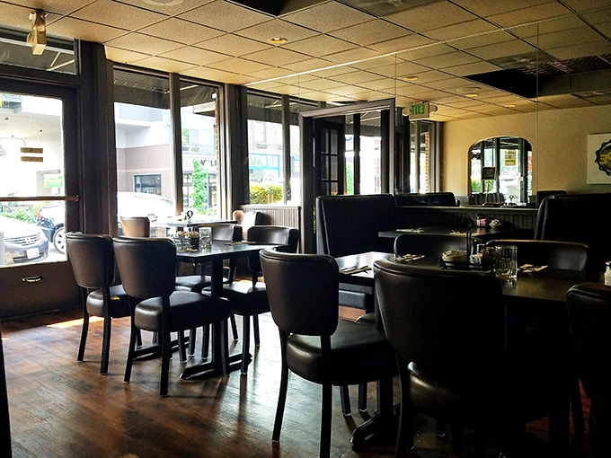 Inside Knapp's, dark wood paneling and comfortable seating create that perfect "I've been coming here for decades" vibe. Morning light streams through windows onto well-worn floors.