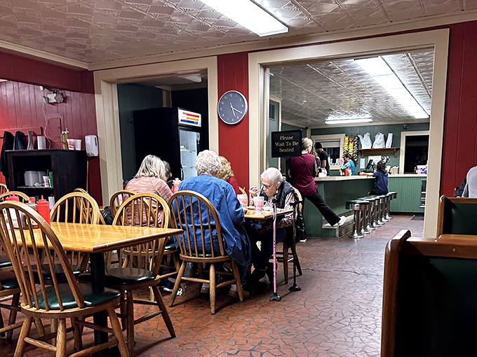 Red walls and wooden chairs create the perfect no-nonsense backdrop for serious eating. This isn't dining theater&mdash;it's barbecue church, and the congregation is hungry.