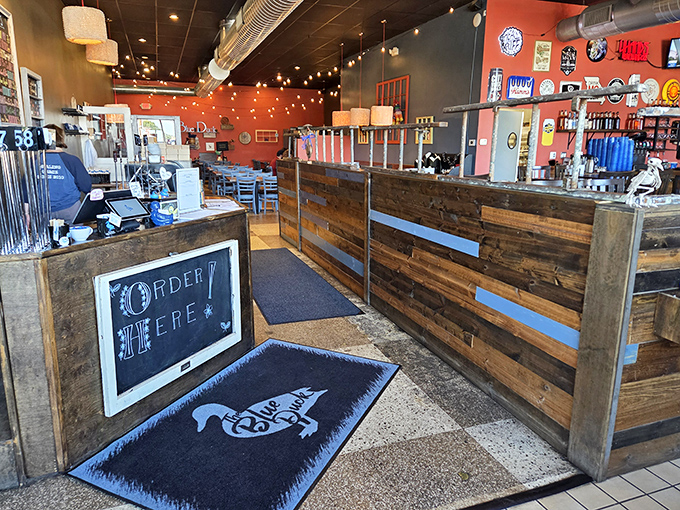 Reclaimed wood, warm lighting, and that "Order Here" sign that might as well say "Happiness Begins Here."