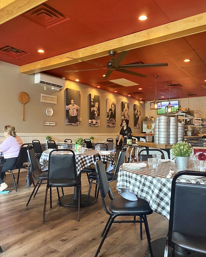 Red ceiling, checkered tablecloths, and Italian icons watching over your meal. This isn't decoration&mdash;it's a promise of authenticity.