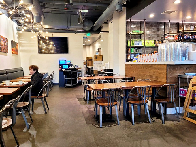 Industrial-chic meets Malaysian comfort in this modern space where conversations flow as freely as the kopi, and every chair awaits its next food pilgrim.