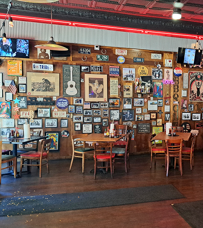 The wall of memorabilia creates a museum of Americana where every bite comes with a side of nostalgia. Spot the G-TRIBE license plate nodding to Cleveland's baseball heritage.