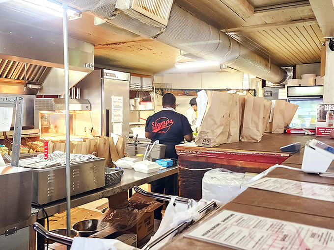 Behind the scenes magic happens here, where paper bags await their destiny as vessels for burger bliss. No frills, just skills.