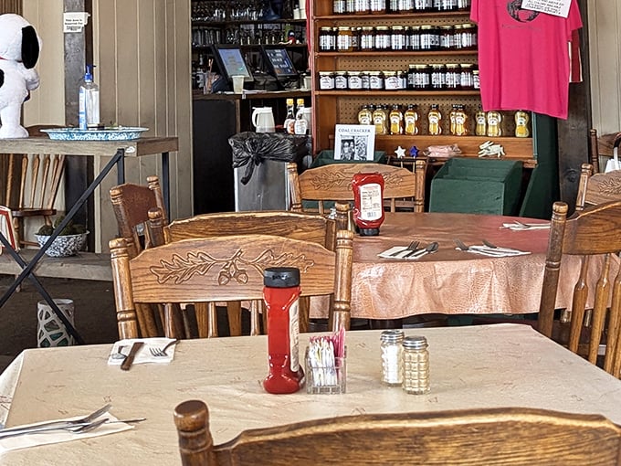 Oak chairs carved with rustic leaf patterns surround tables where countless meals and memories have been shared. The gift shop in back tempts with take-home treasures.