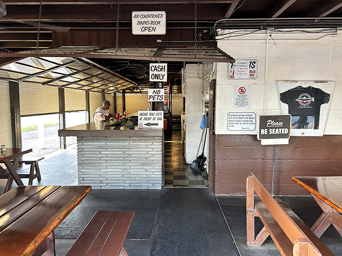 No-frills dining at its finest&mdash;picnic tables, wooden benches, and a "Please Be Seated" sign that might as well read "Prepare for Deliciousness."