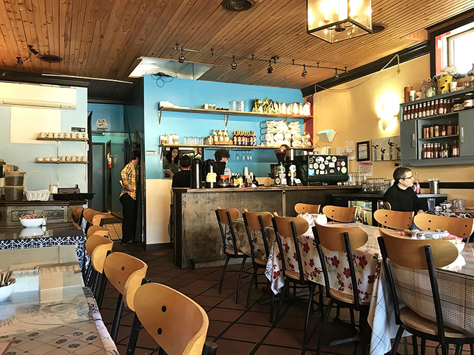 Wooden ceiling panels and sky-blue walls create that rare atmosphere that's both cozy and energizing&mdash;like breakfast jazz in architectural form.