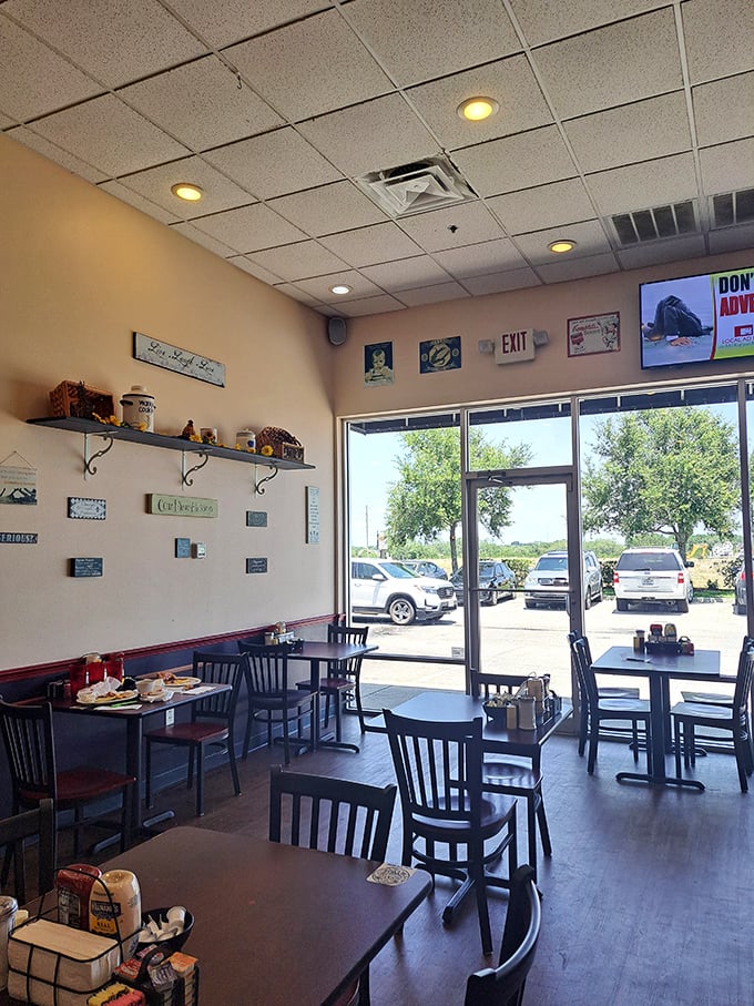 Sunlight streams through windows illuminating a classic diner interior where breakfast dreams and lunchtime fantasies come to life on plates bigger than your ambitions.
