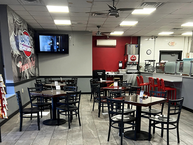Simple, clean, and focused on what matters &ndash; the food. Those red chairs aren't just for show; they're front-row seats to a sandwich symphony.