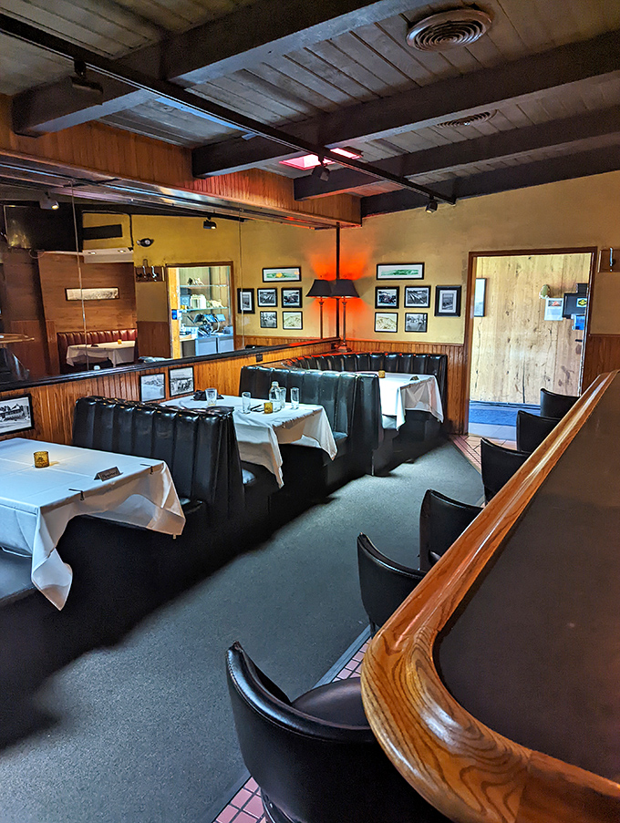 Dark leather booths and wood-paneled walls create the perfect backdrop for serious steak consumption and not-so-serious conversation.