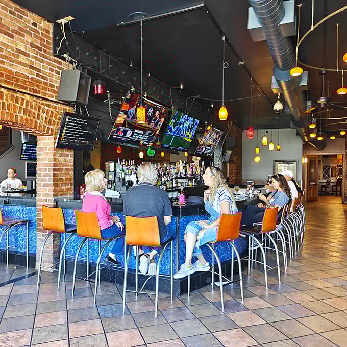 The blue-accented bar area strikes that perfect balance&mdash;upscale enough for date night, casual enough for Tuesday's dinner craving.