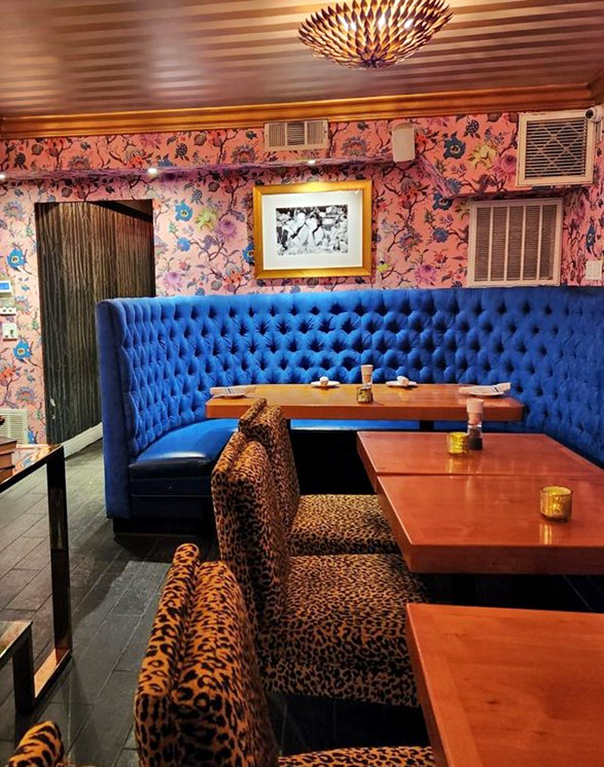 Blue velvet booths meet floral wallpaper and leopard print in a design mashup that somehow works perfectly. It's like your eccentric aunt's living room&mdash;if she were a culinary genius.