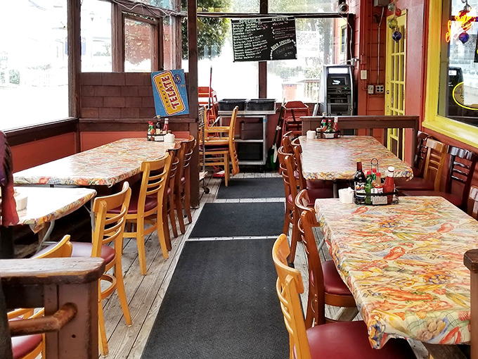 No-frills nautical charm defines the interior, where patterned tablecloths and wooden furnishings create the perfect stage for seafood's starring role.