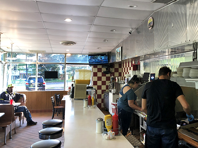 The choreography of short-order cooking unfolds before your eyes in this compact space where every inch serves a purpose. 