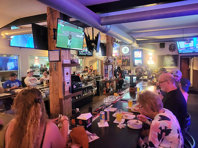 Where food dreams come true: Bigham's bustling bar area, where locals gather to watch the game and debate wing flavors with religious fervor.