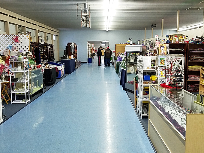 The blue-floored corridors stretch like possibility highways, inviting shoppers to wander through a carefully organized chaos of potential finds.