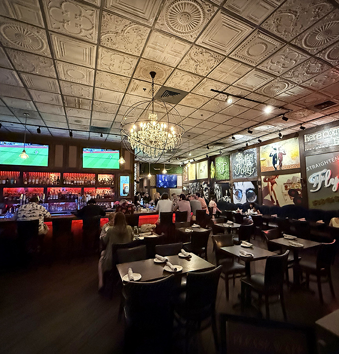 Ornate tin ceiling tiles meet crystal chandeliers in this unexpected mashup of elegance and comfort. Somewhere between fancy and familiar, Cowbell found its sweet spot.