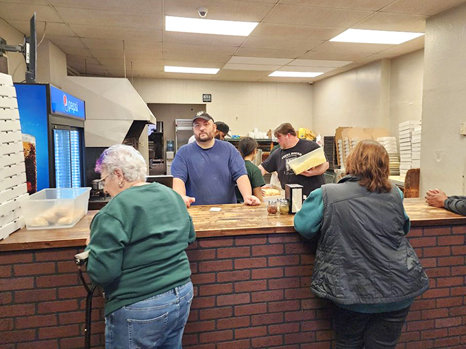 The counter where pizza dreams come true. No fancy frills, just locals who know they've found the real deal in Ambridge.