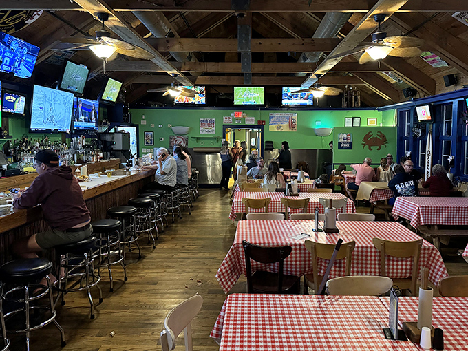 Classic red and white checkered tablecloths set the stage for the messy masterpiece about to unfold. No pretension here&mdash;just serious seafood business.