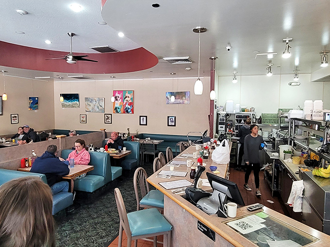 Inside, teal booths and local artwork create that perfect diner atmosphere&mdash;comfortable enough to linger, bustling enough to know you're somewhere special.