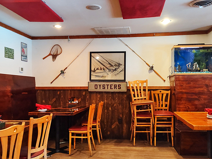 Fishing rods mounted on rustic wood paneling create that perfect "just caught it this morning" atmosphere. The "OYSTERS" sign isn't kidding around—they mean business here.