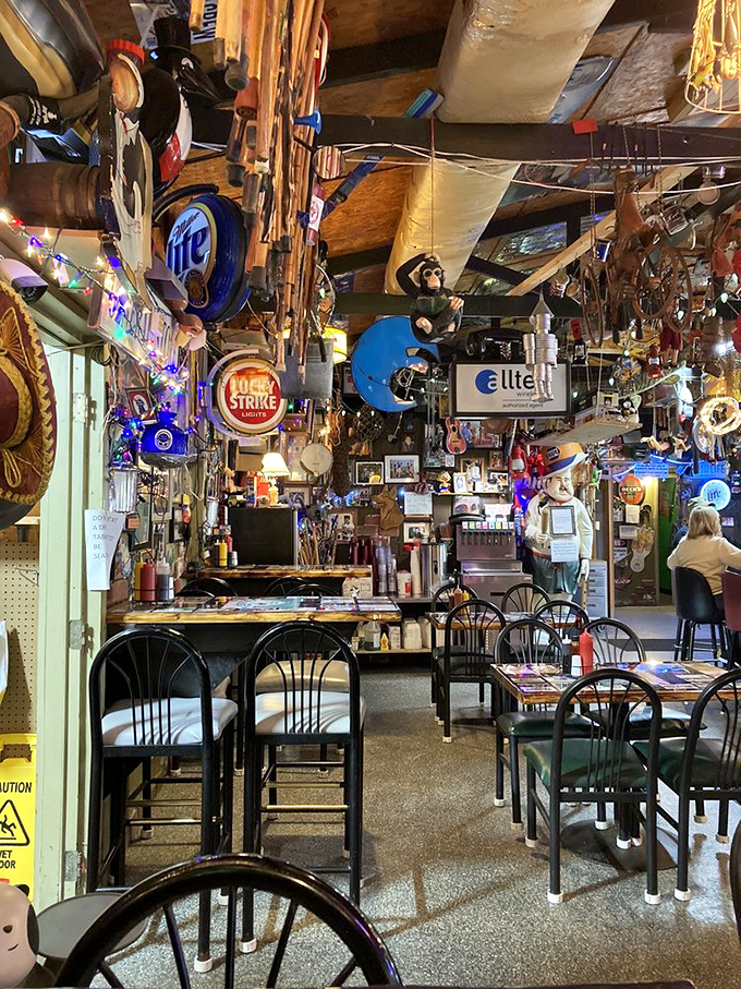 Where every inch tells a story! The ceiling-to-floor memorabilia creates a museum of good times, with beer signs illuminating decades of fishing tales and satisfied appetites.