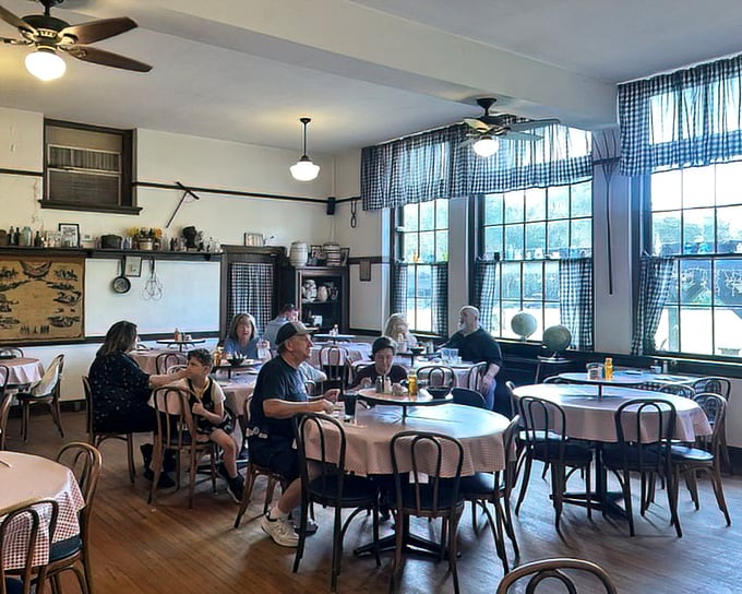 Blue gingham curtains and round tables create the classroom of your culinary dreams. No detention here &ndash; just delicious detention-worthy dishes.