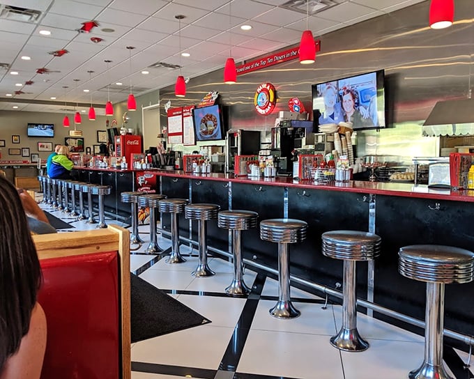 Classic Americana at its finest &ndash; chrome stools, checkered floors, and conversations that flow as freely as the coffee.