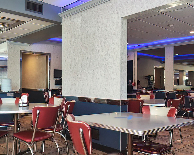 Red vinyl chairs and chrome-edged tables create that perfect nostalgic atmosphere where conversations flow as freely as the coffee.