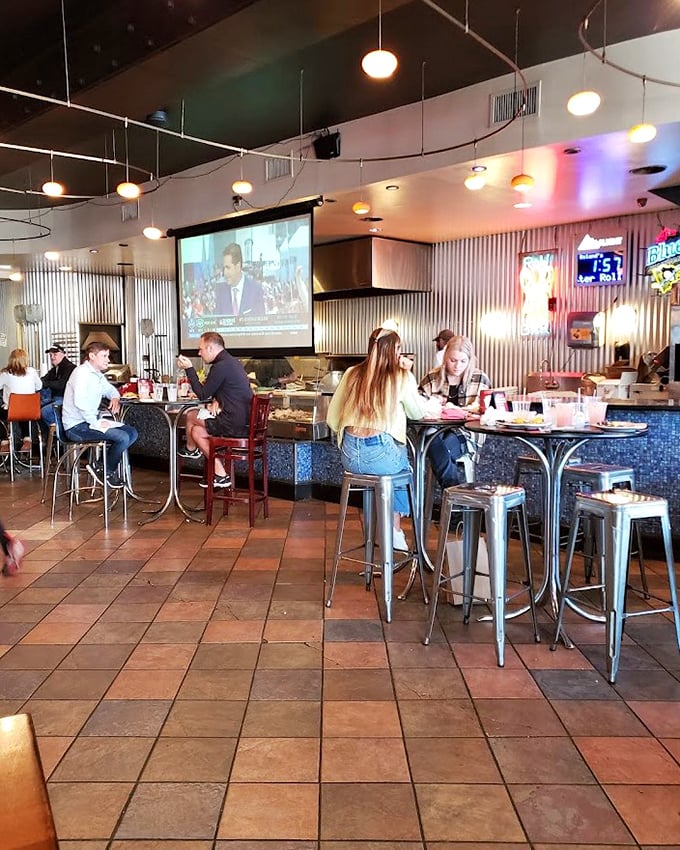 Inside, terra cotta tiles meet industrial chic, creating that perfect sweet spot between "nice enough for date night" and "comfortable enough for Tuesday."