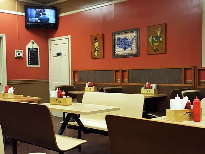 Simple booths, wood paneling, and walls the color of barbecue sauce &ndash; this isn't interior design, it's barbecue authenticity in its natural habitat.