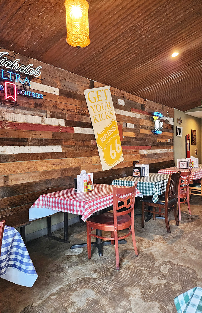 Reclaimed wood walls, checkered tablecloths, and that "Get Your Kicks" Route 66 banner &ndash; this isn't designer d&eacute;cor, it's authentic American comfort at its finest.