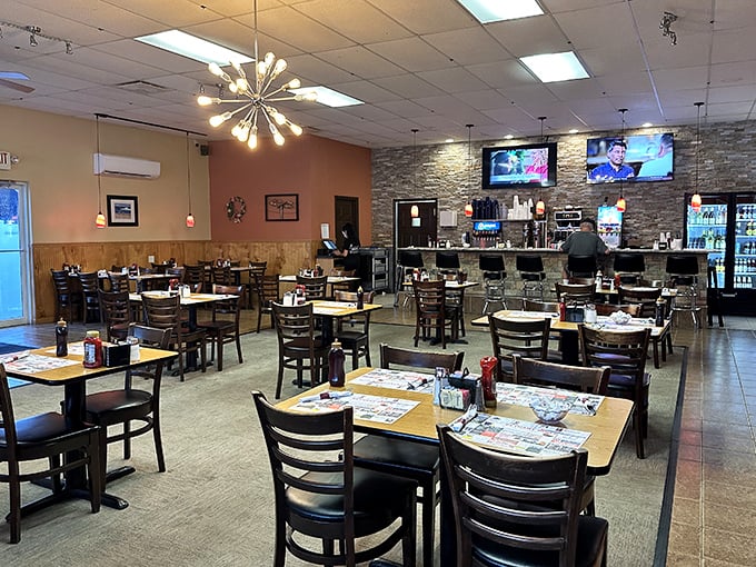 Modern meets classic in this inviting dining space. The starburst light fixture adds a touch of retro flair to conversations over coffee.