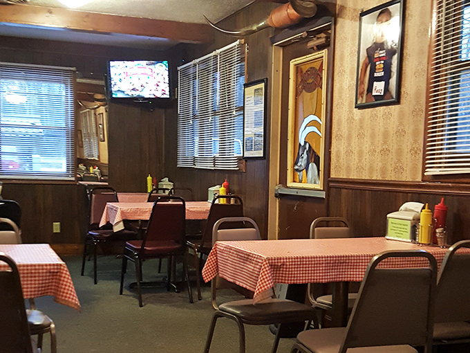 Classic red-checkered tablecloths and wood-paneled walls create that perfect time-capsule diner atmosphere where conversations flow as freely as the coffee.