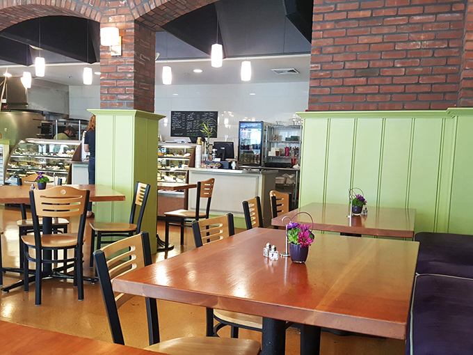 Inside, brick archways and mint-green wainscoting create that perfect "fancy but not too fancy" vibe where both jeans and pearls feel equally at home.