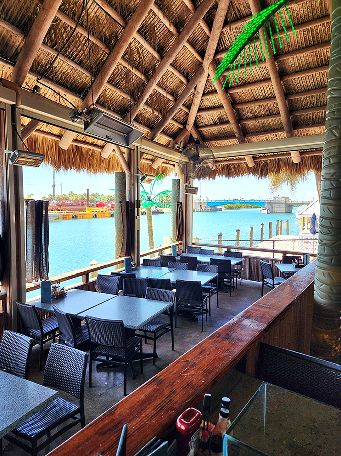 Dine under a thatched tiki roof with water views so perfect, you'll forget you're not on vacation in some exotic locale.