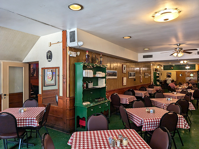 Red and white checkered tablecloths, wood-paneled walls, and that distinctive green hutch—stepping into Meloni's feels like traveling back to a simpler time.