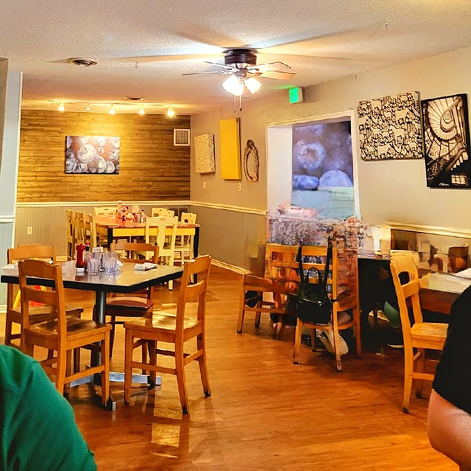 Wooden accents, warm lighting, and cozy tables create the perfect backdrop for morning conversations and pancake revelations.