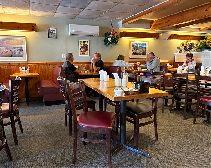 Wood paneling and burgundy booths create the perfect time capsule where conversations flow as freely as the coffee refills.