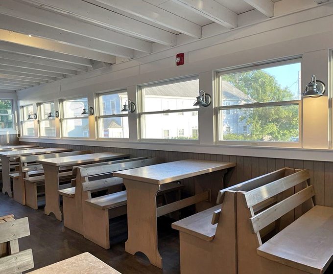 Simple wooden benches and bright windows create a no-frills dining room where the food does all the talking it needs to.